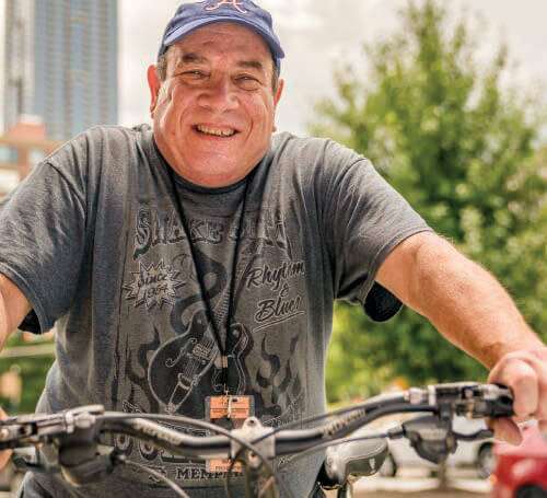 Chris Riding Bicycle Atlanta Mission